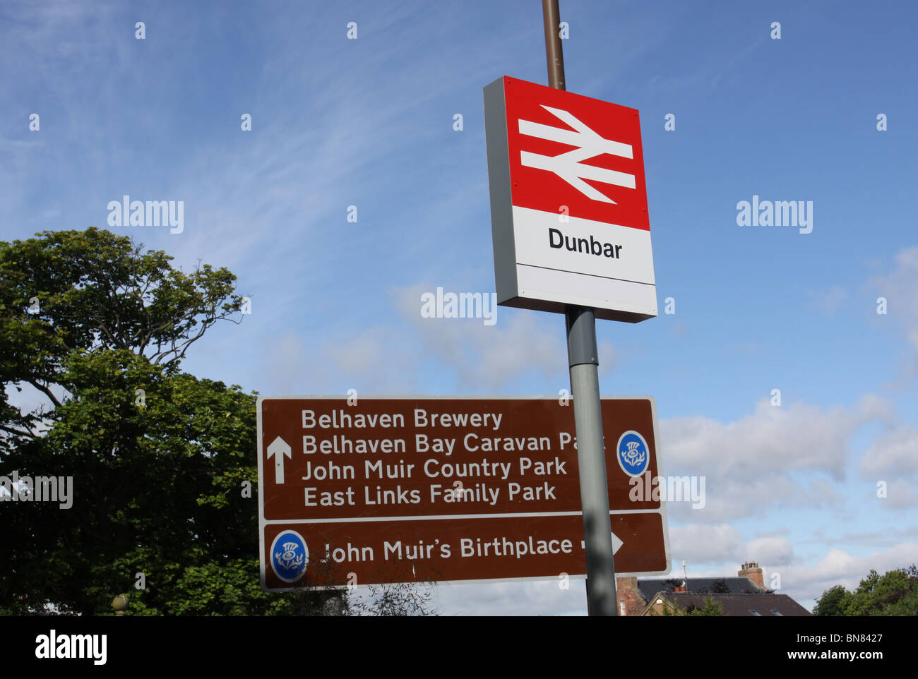 Dunbar railway station sign with tourism sign Scotland June 2010 Stock ...