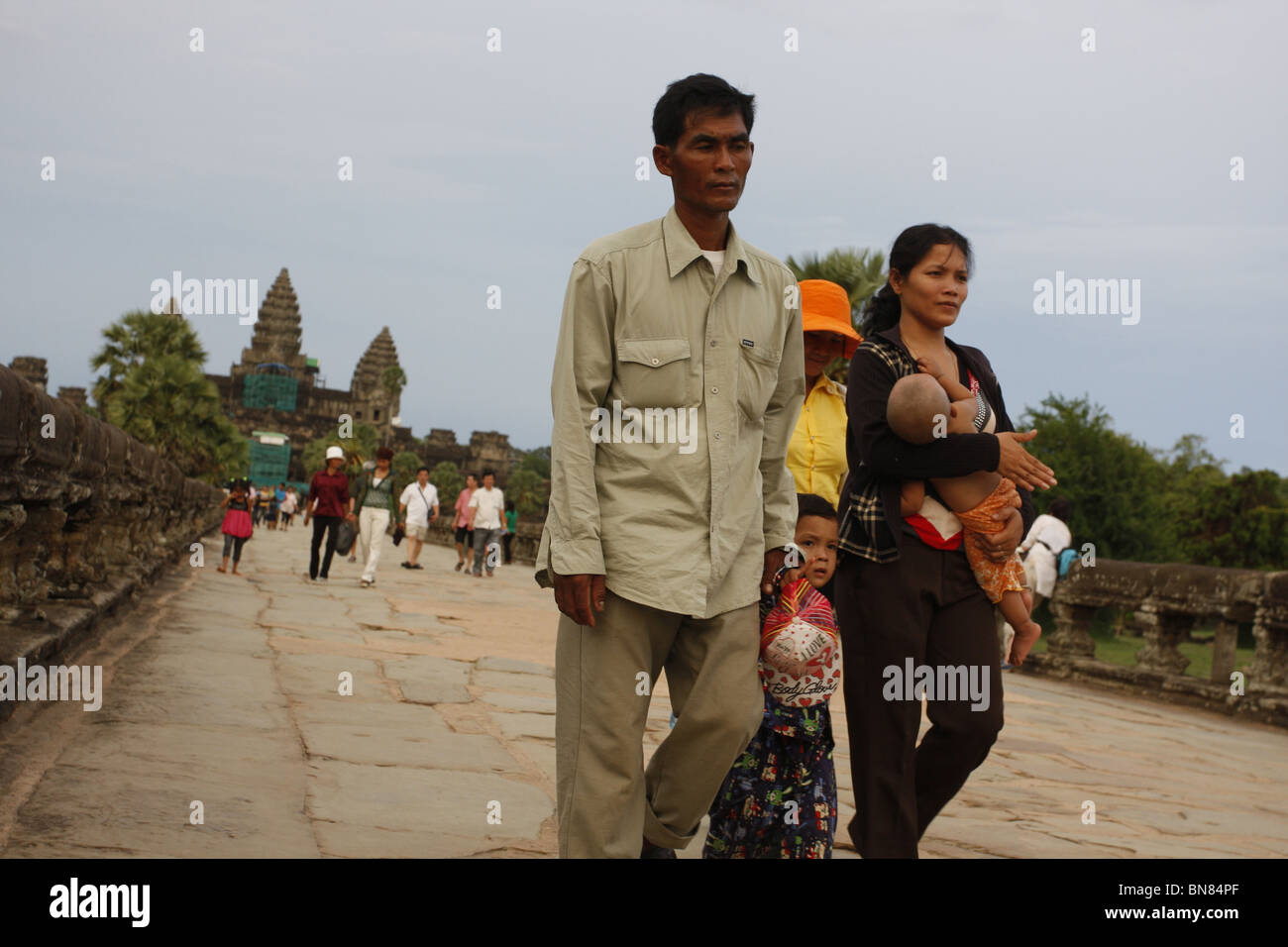 Cambodian visitors on the causeway to Angkor Wat Stock Photo - Alamy