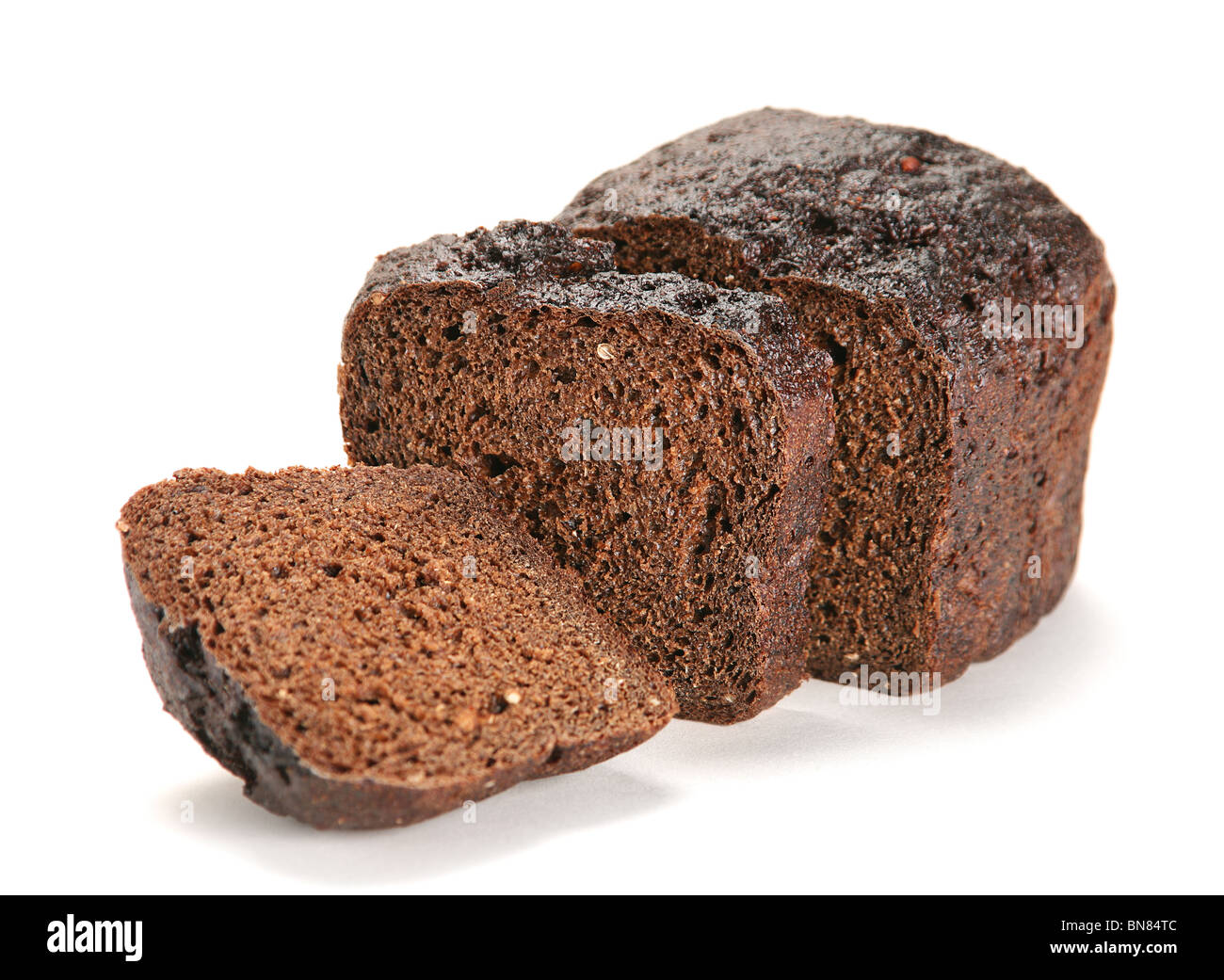 Black bread closeup on white with slice Stock Photo - Alamy