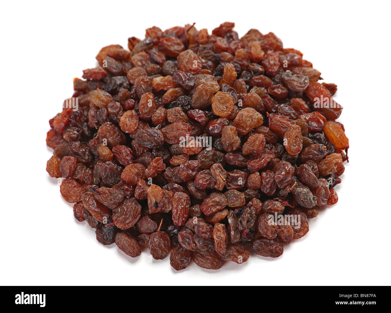 Brown dried fruit closeup raisin on white Stock Photo - Alamy