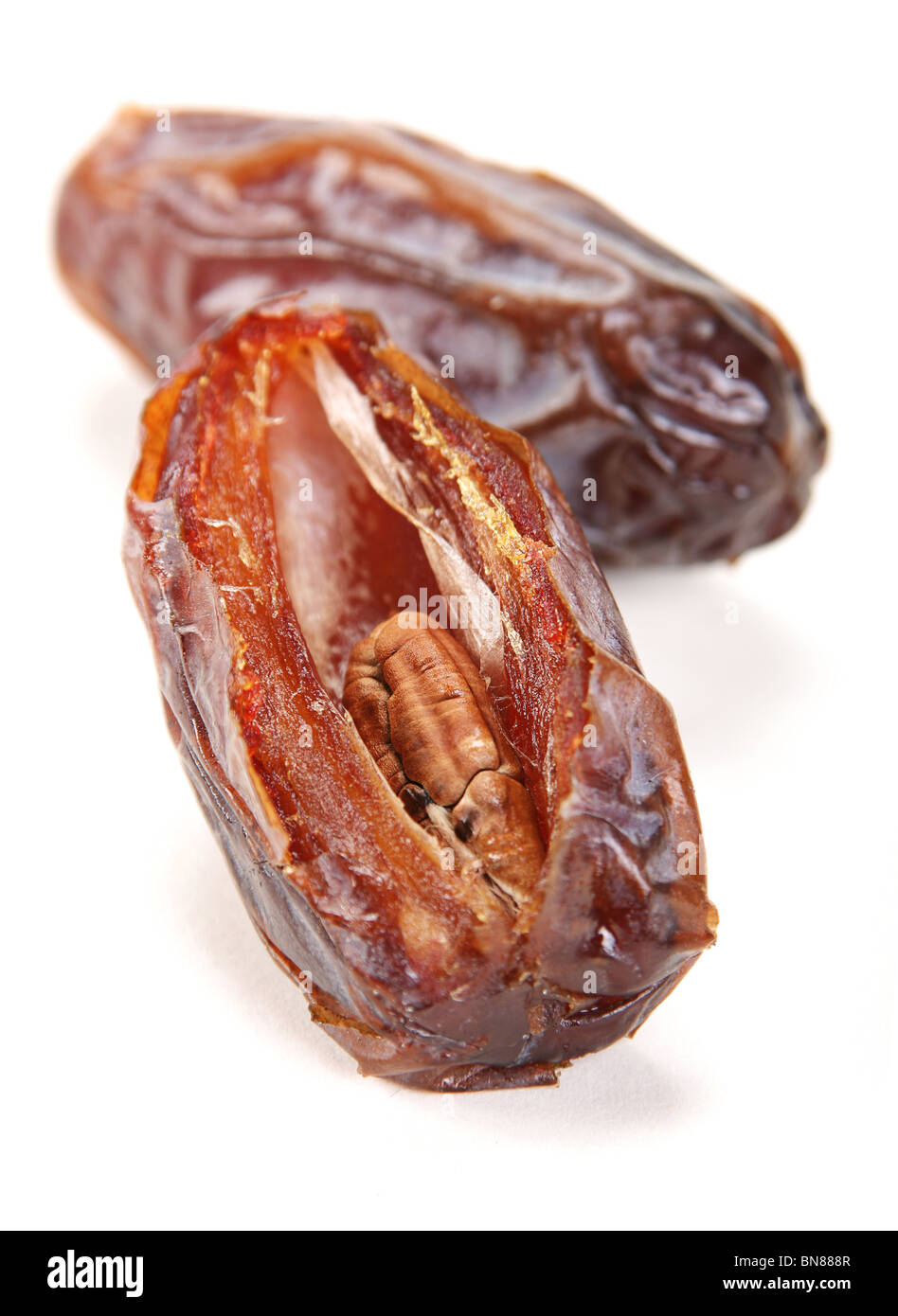Big date dried fruit closeup on white background Stock Photo - Alamy