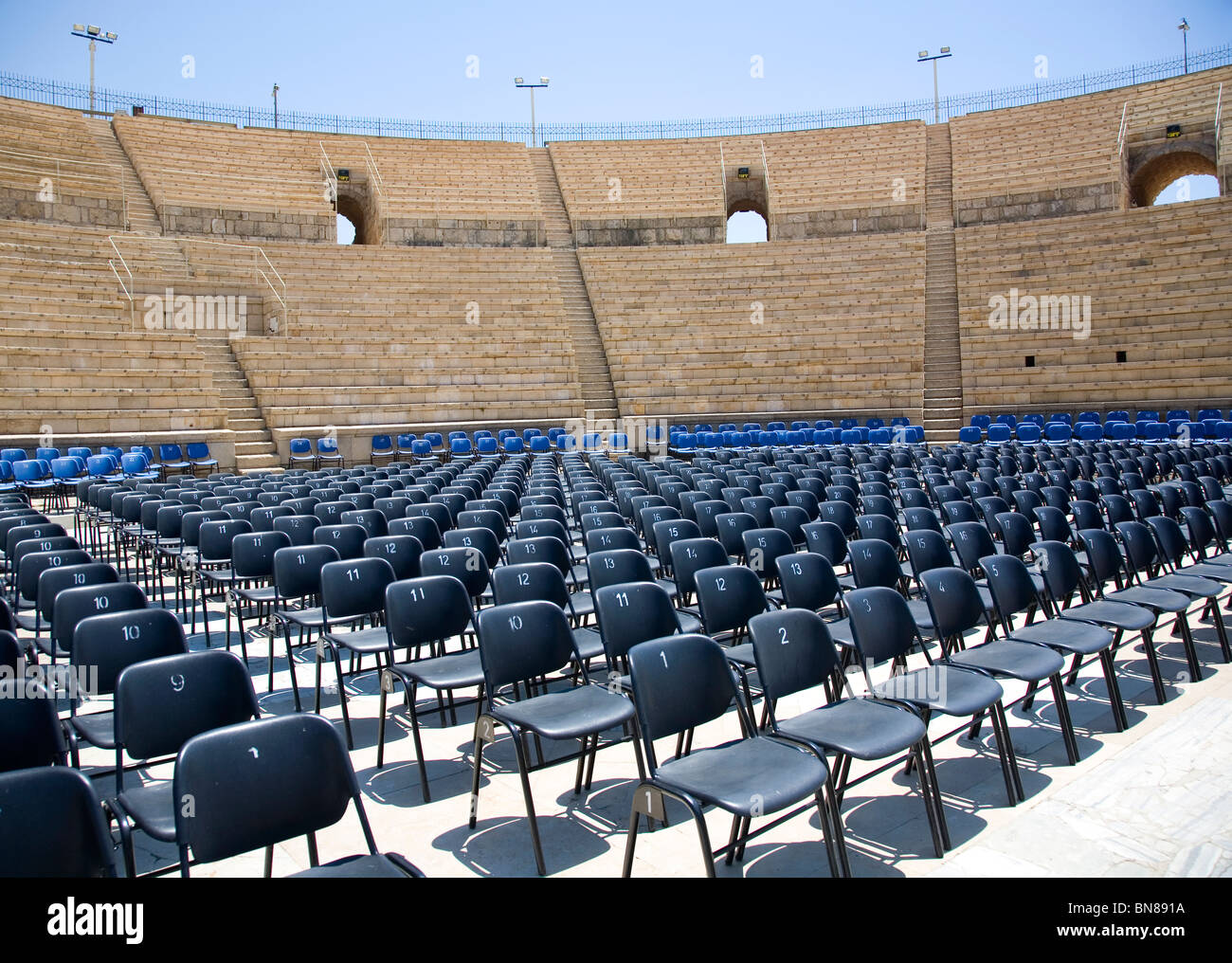 Numbered seating at the amphitheater in Caesarea, Israel Stock Photo ...