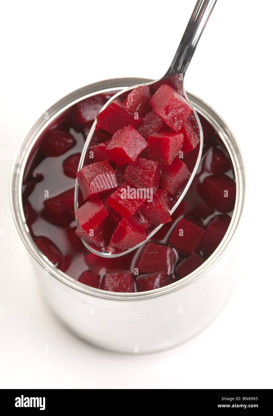 Beet slice preserved in metal spoon on white Stock Photo - Alamy