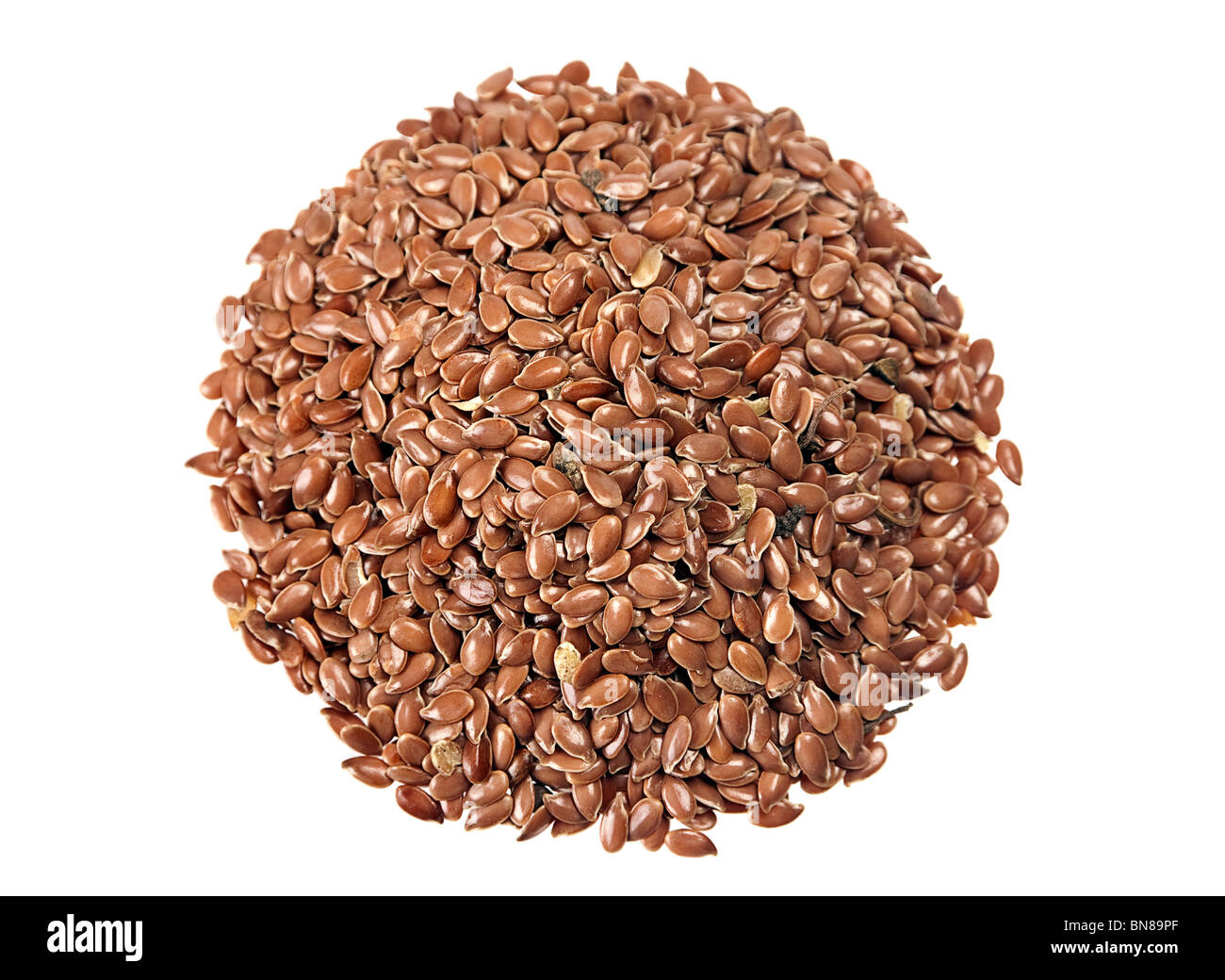Flax seed round heap on white Stock Photo - Alamy