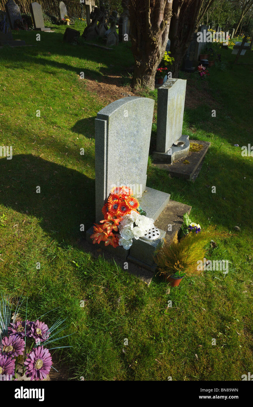 gravestones lit by the sun in a country cemetery Stock Photo - Alamy