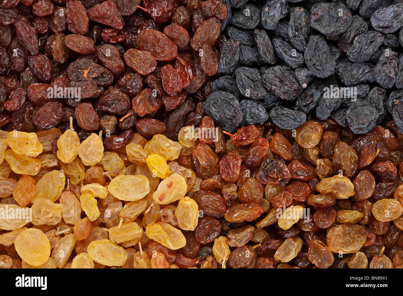 Four sort dried fruit raisin closeup background Stock Photo - Alamy