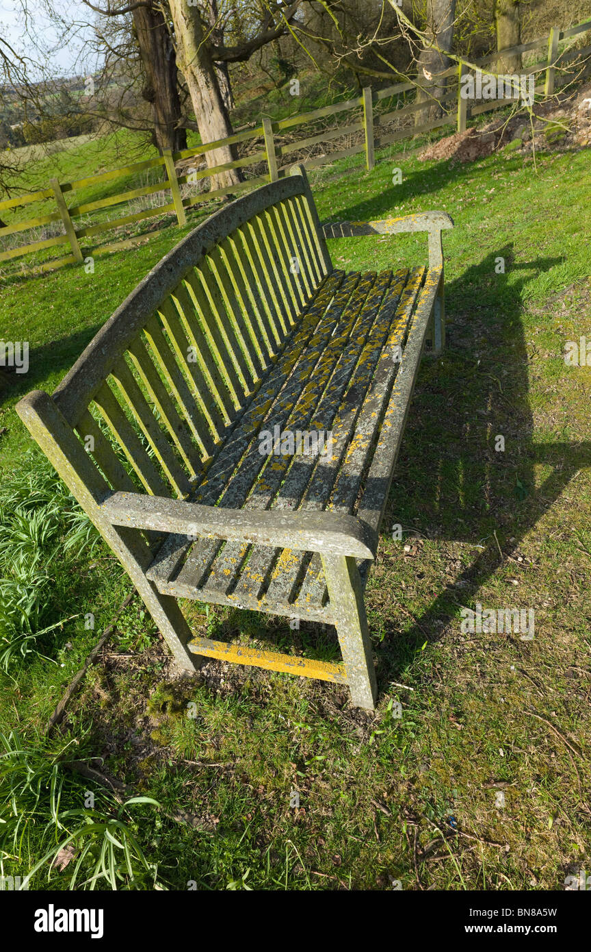a bench in a country garden Stock Photo - Alamy