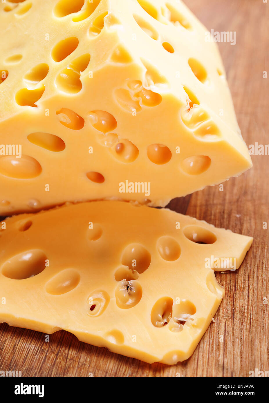 Cheese dairy product closeup with slice Stock Photo - Alamy