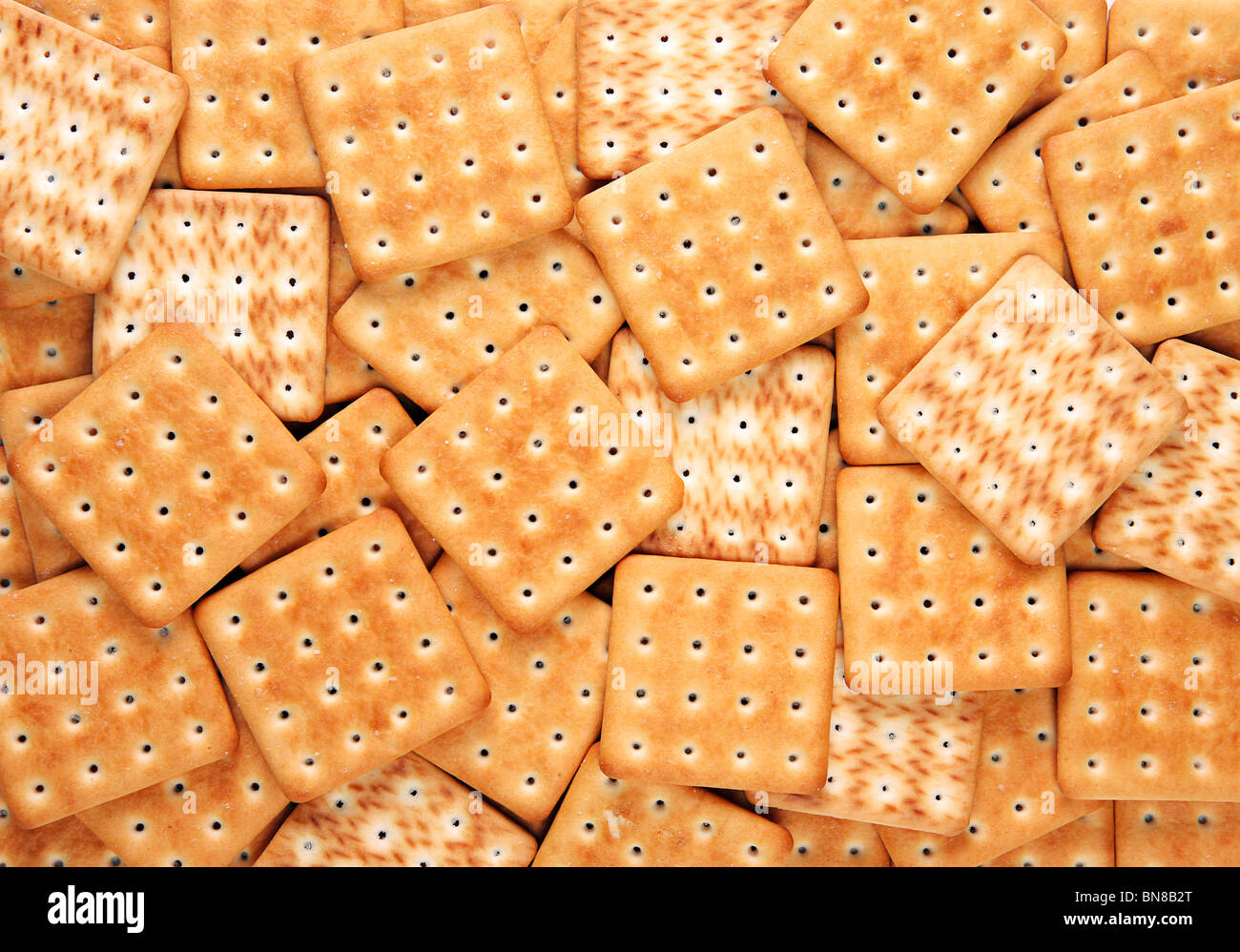 Salt square crackers closeup background Stock Photo - Alamy