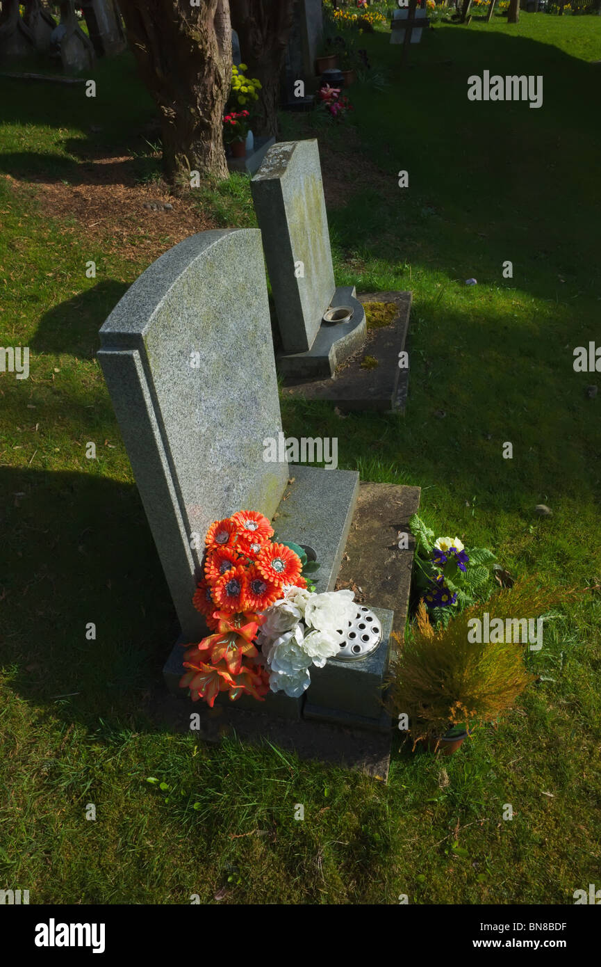gravestones lit by the sun in a country cemetery Stock Photo - Alamy