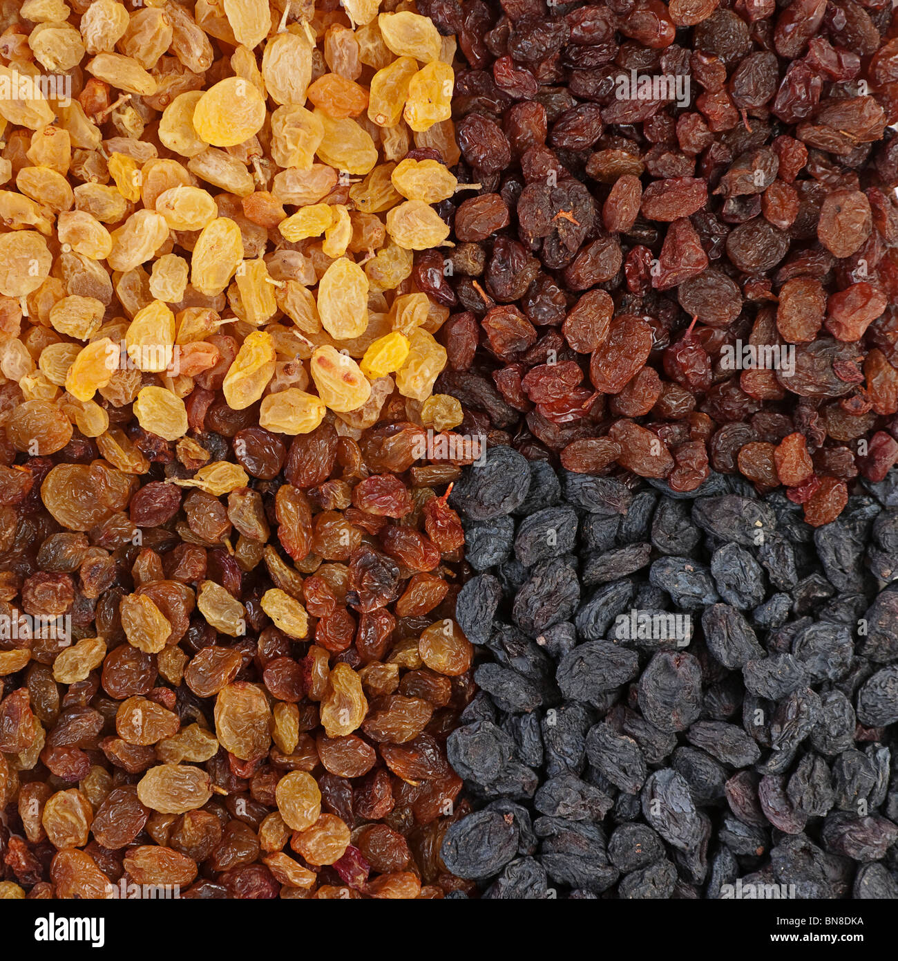 Four sort dried fruit raisin closeup background Stock Photo - Alamy