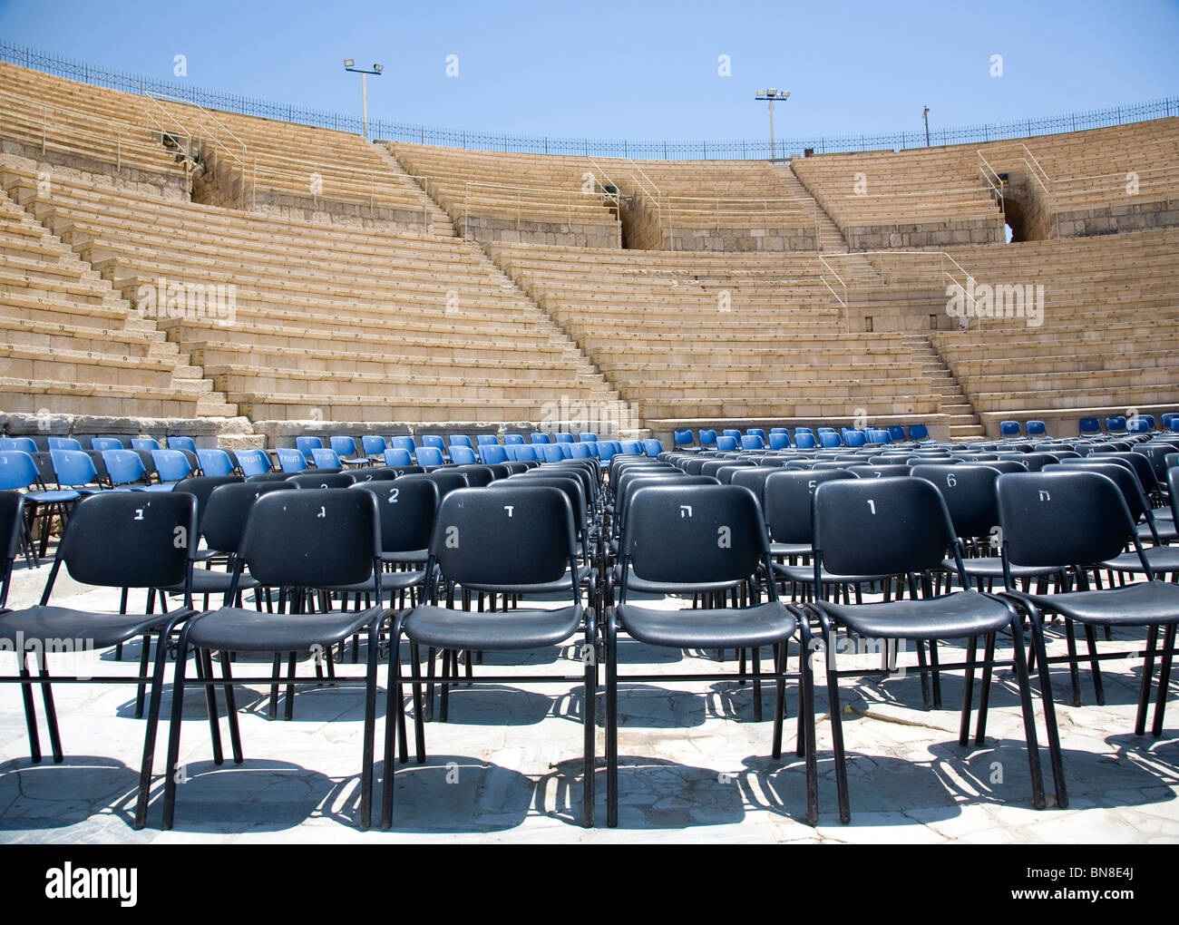 Numbered seating at the amphitheater in Caesarea, Israel Stock Photo ...