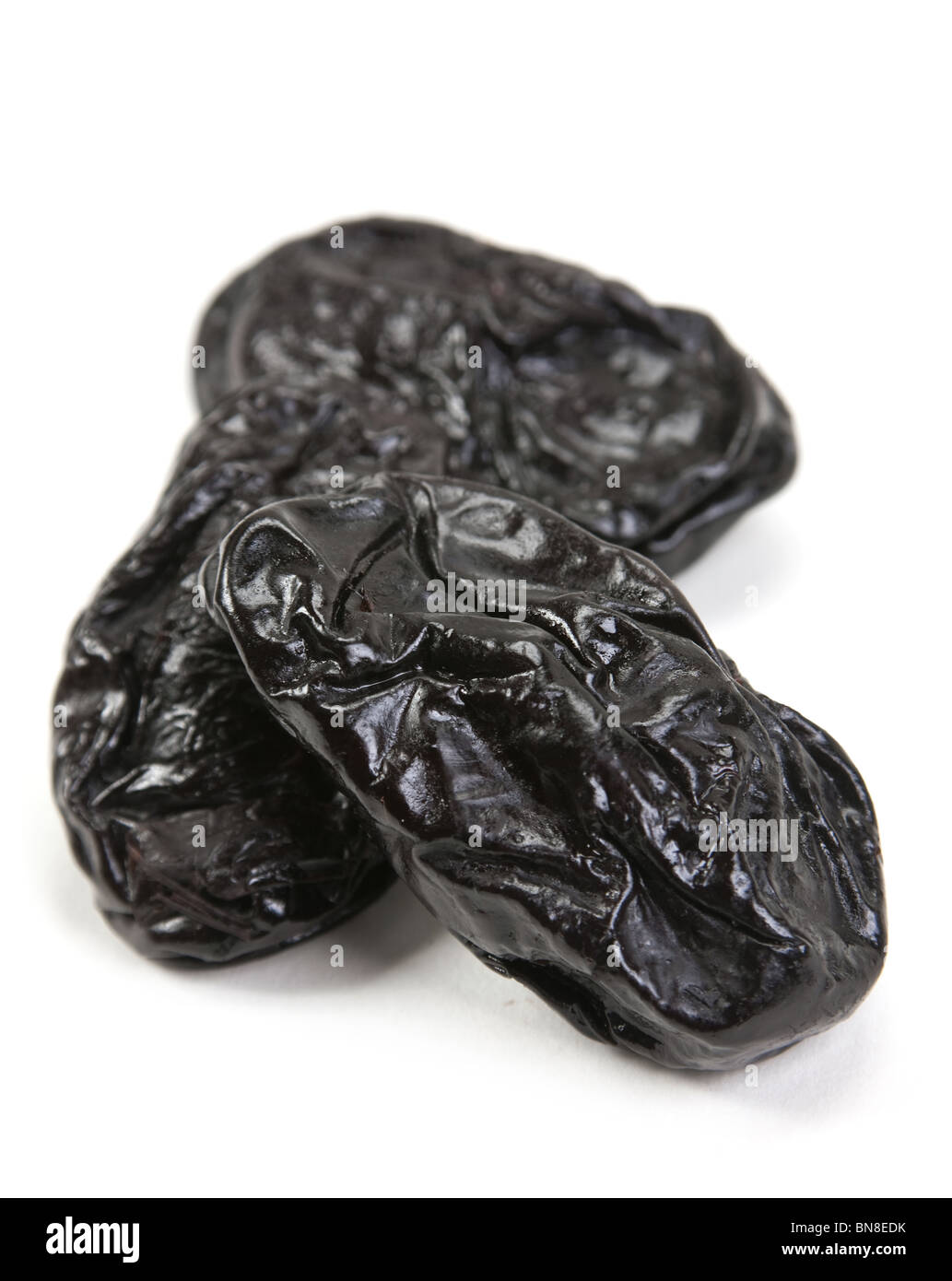 Dried fruit prune closeup on white background Stock Photo - Alamy