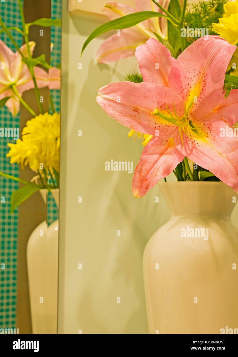 Vase full of flowers with a reflection in a mirror Stock Photo - Alamy