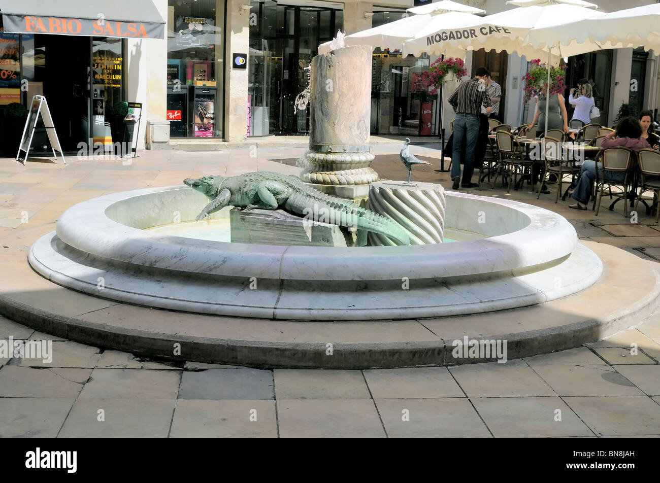 .A statue of a crocodile , the city symbol of Nimes, France Stock Photo ...