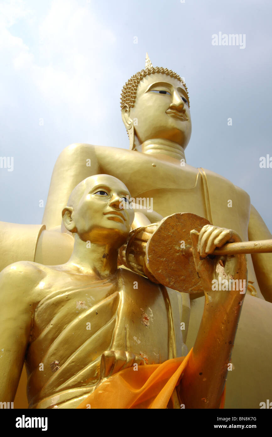 Two Big Golden Monk in Thailand Stock Photo - Alamy