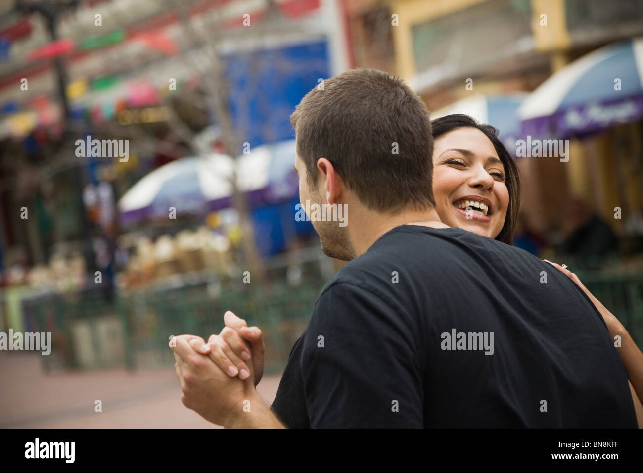 Laughing couple dancing outdoors Stock Photo - Alamy