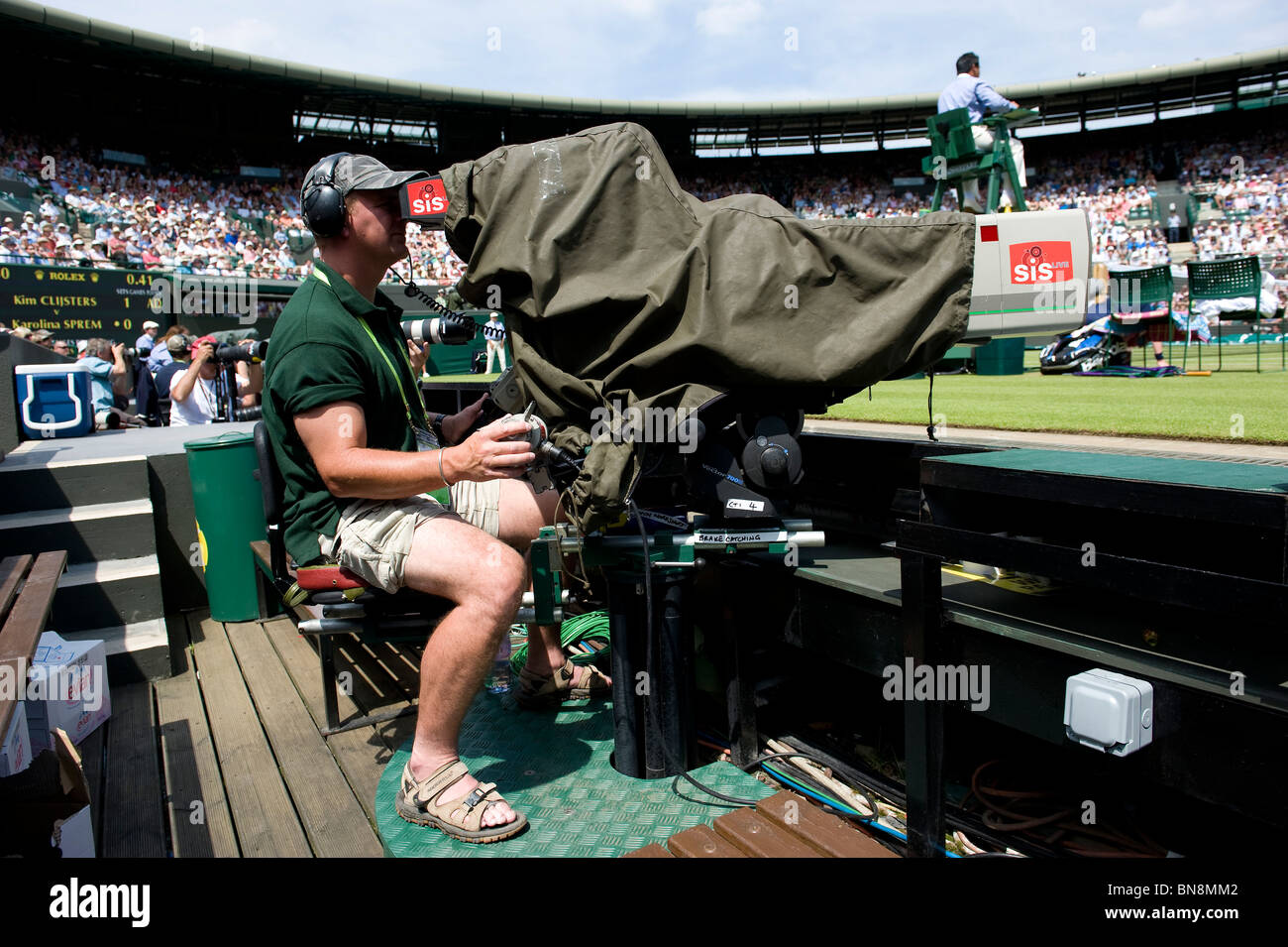 TV camera man films on court 1 during the Wimbledon Tennis ...
