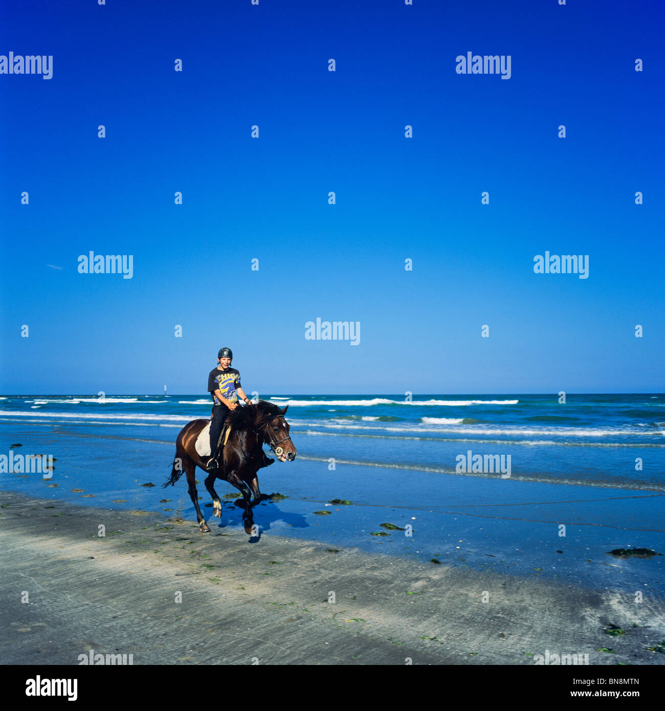 BOY RIDING HORSE BEACH BETTYSTOWN COUNTY MEATH IRELAND EUROPE Stock ...
