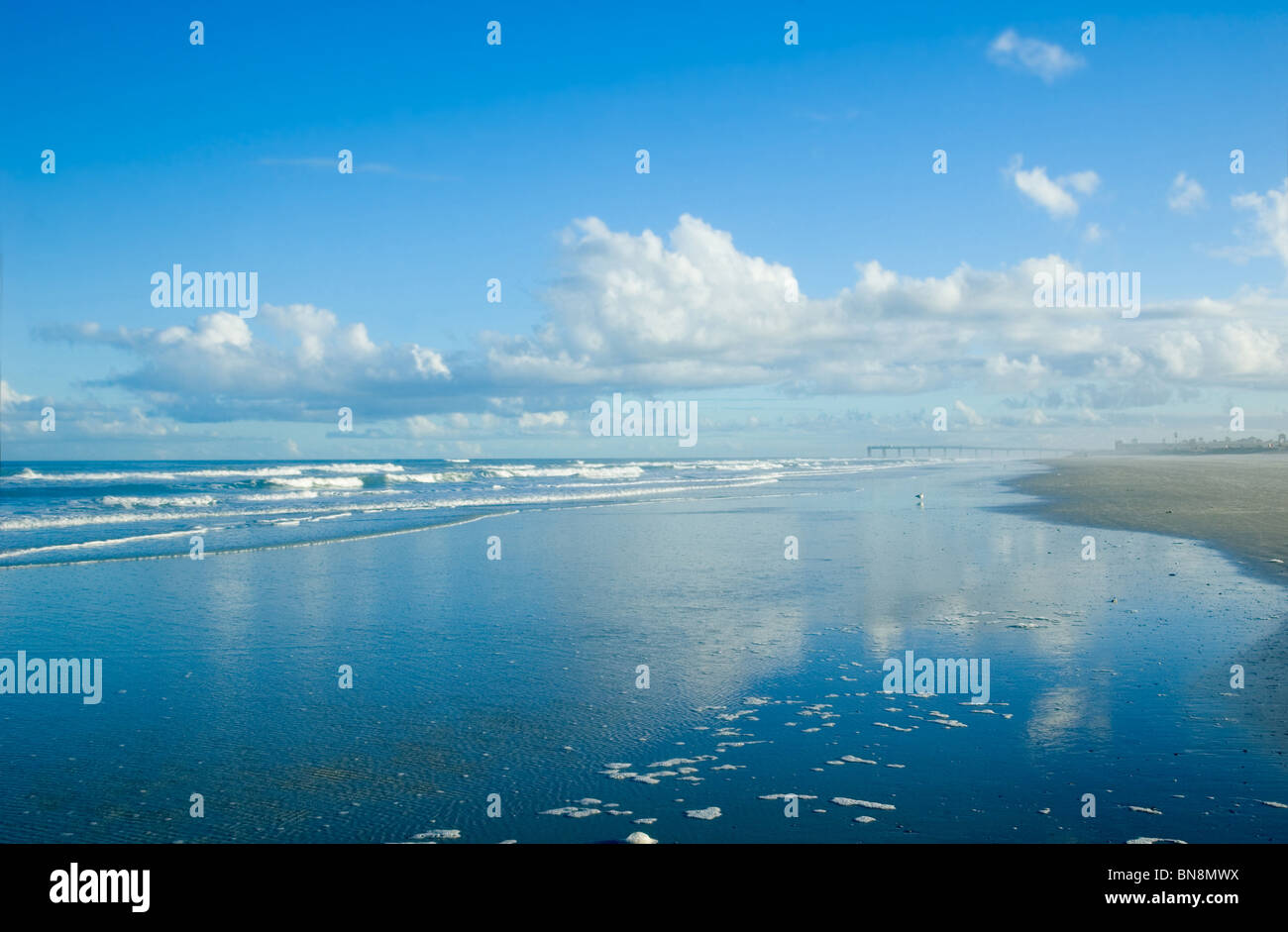 Beautiful ocean surf reflecting vibrant blue sky Stock Photo - Alamy