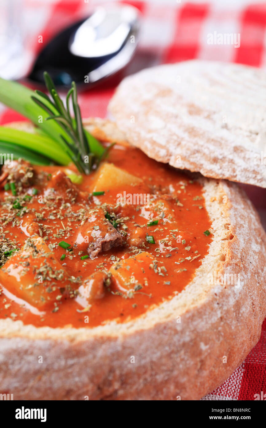 Beef stew in a bread bowl Stock Photo - Alamy