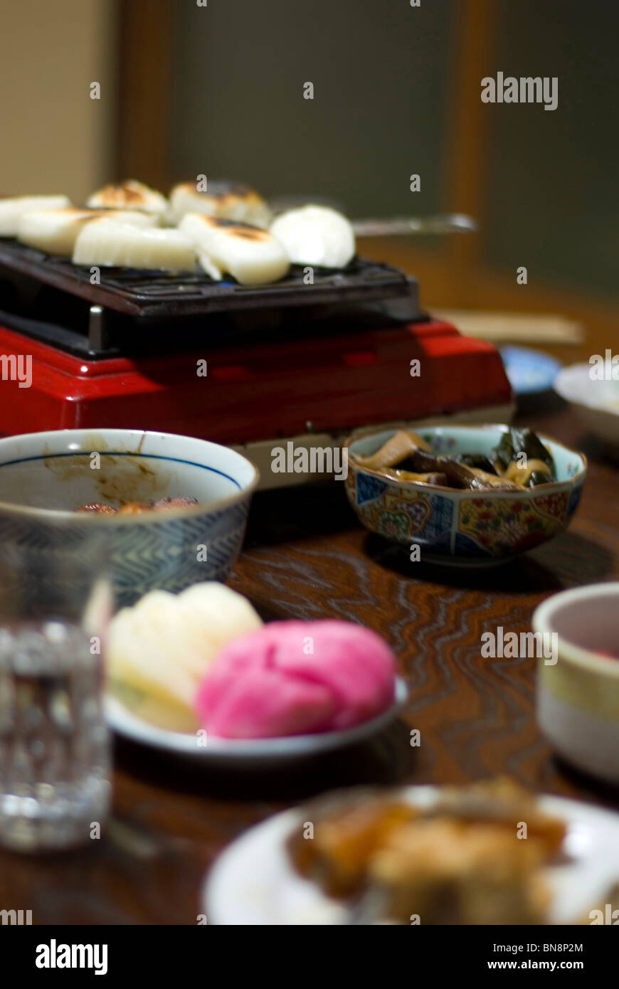 A traditional Japanese meal cooked at the table Stock Photo - Alamy