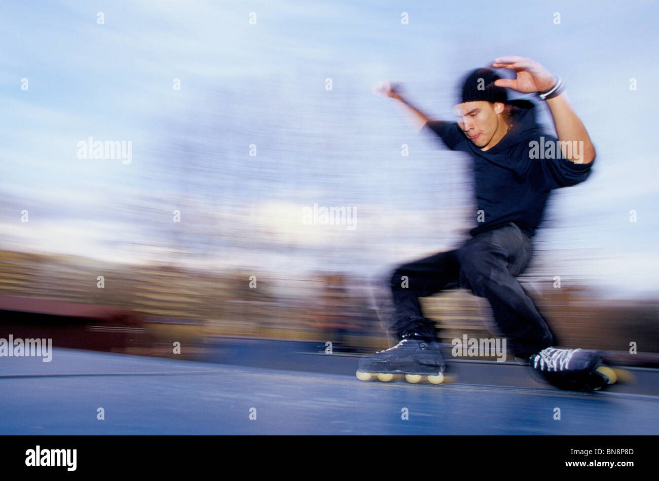 Rollerblader grinding on a ramp. Autumn 2001 Stock Photo - Alamy