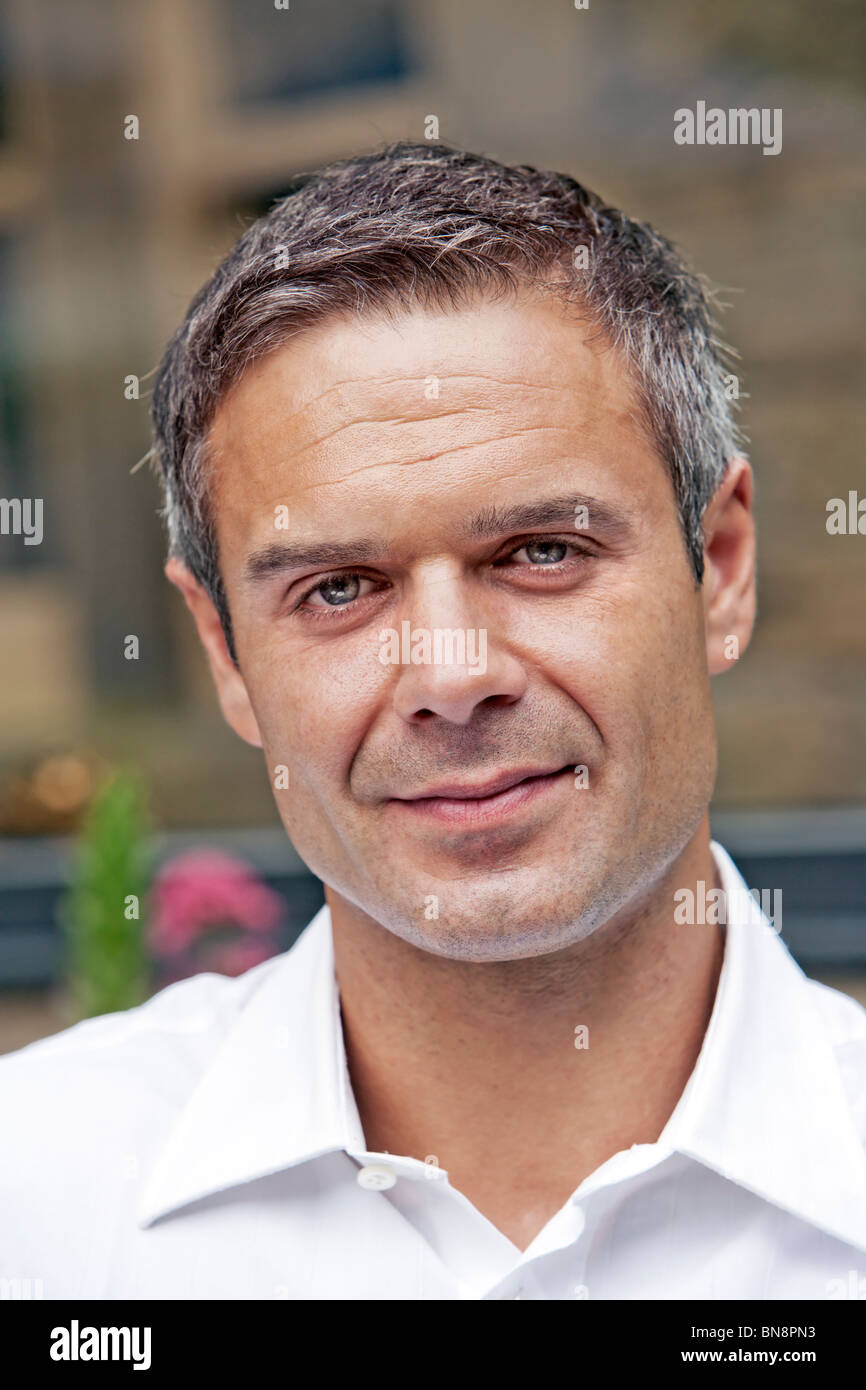 Man smiling outdoors Stock Photo - Alamy