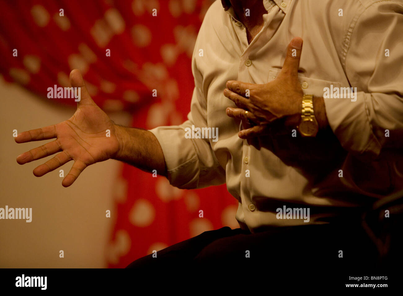 A Flamenco singer, or cantaor, holds his heart as he sings in a ...