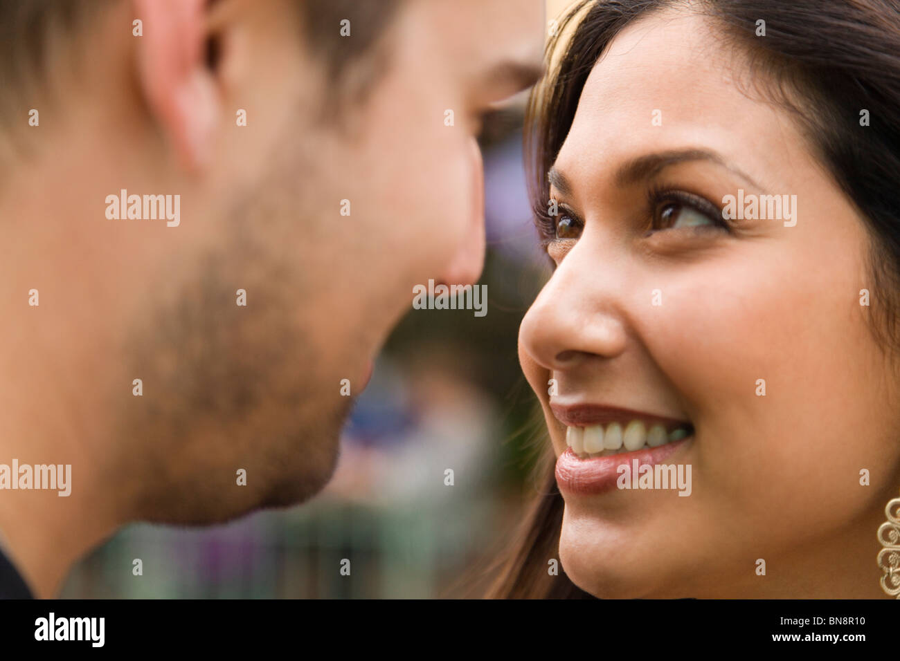 Couple smiling at each other Stock Photo - Alamy
