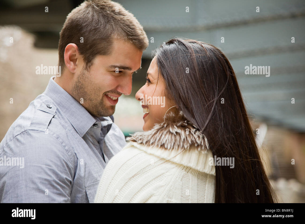 Couple smiling at each other Stock Photo - Alamy