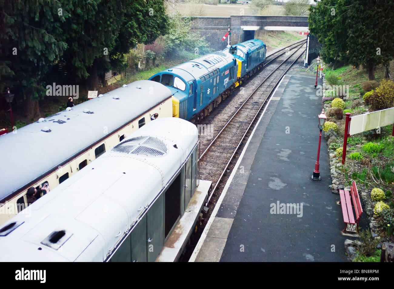 A station on a railway line in the countryside Stock Photo - Alamy