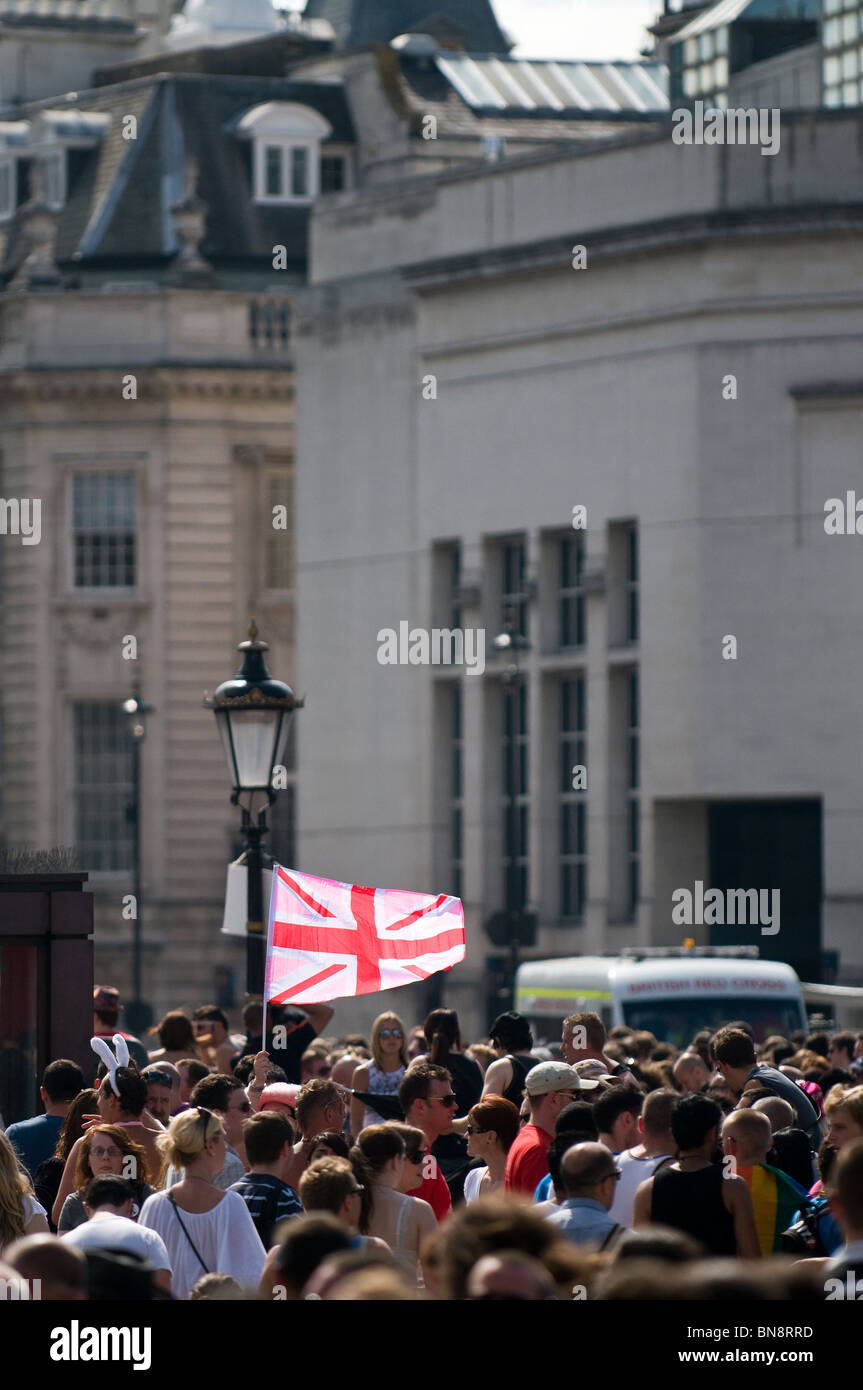 A pink Union flag held above a crowd at the Pride London celebrations ...