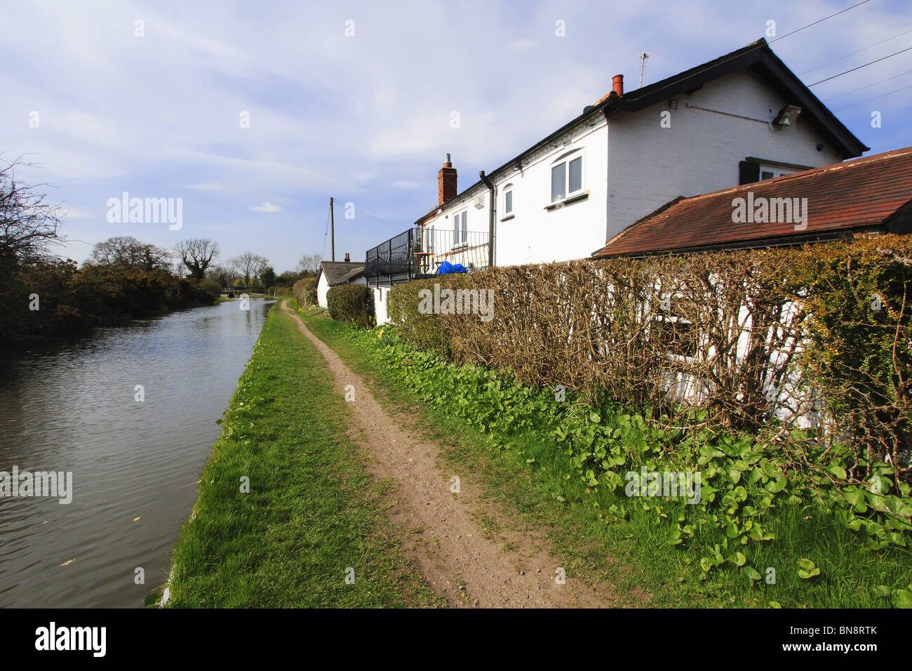 Houses next to canal or river Stock Photo - Alamy