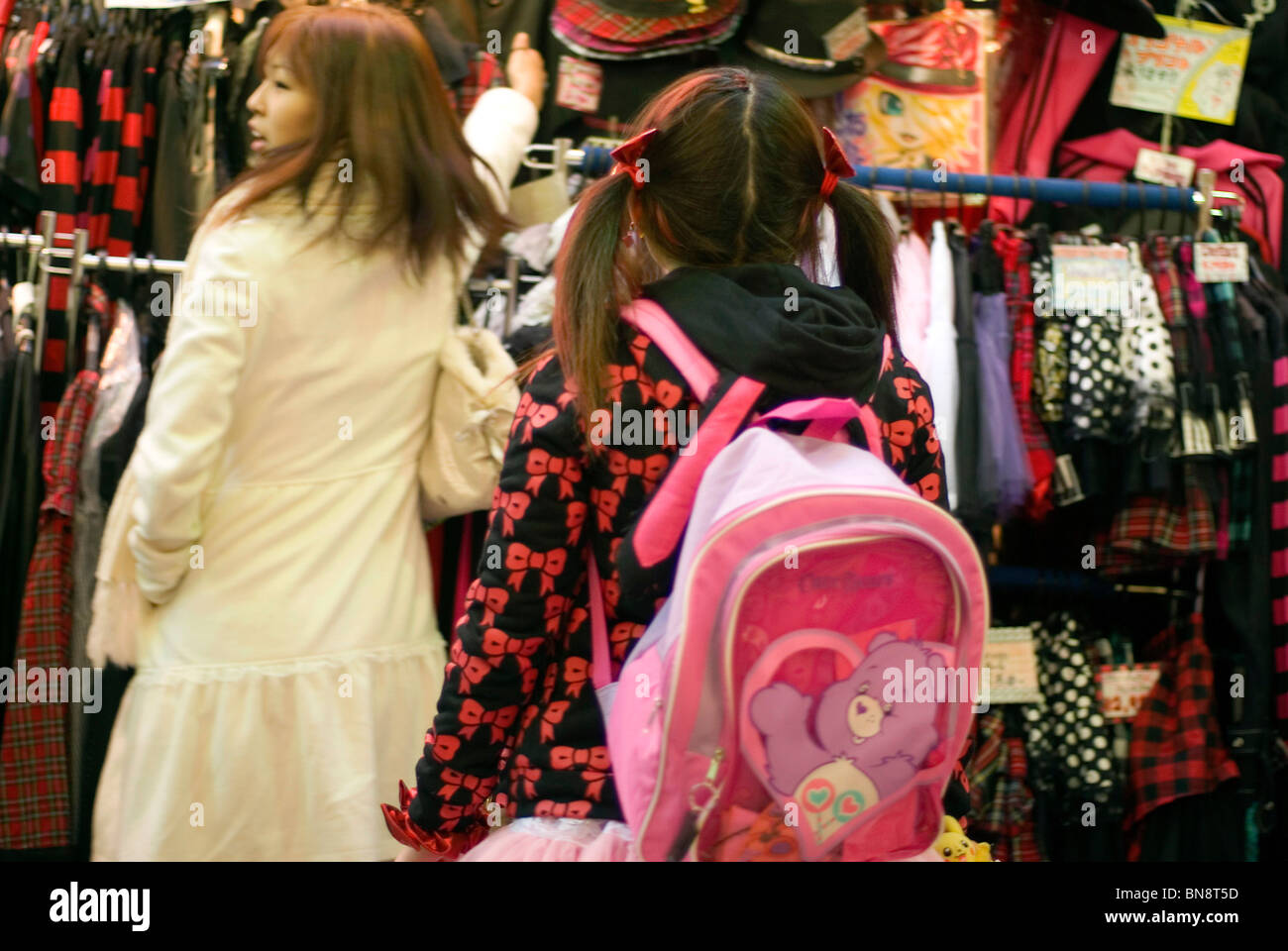 The funky and fashionable area of Harajuku in Tokyo. Two young girls ...