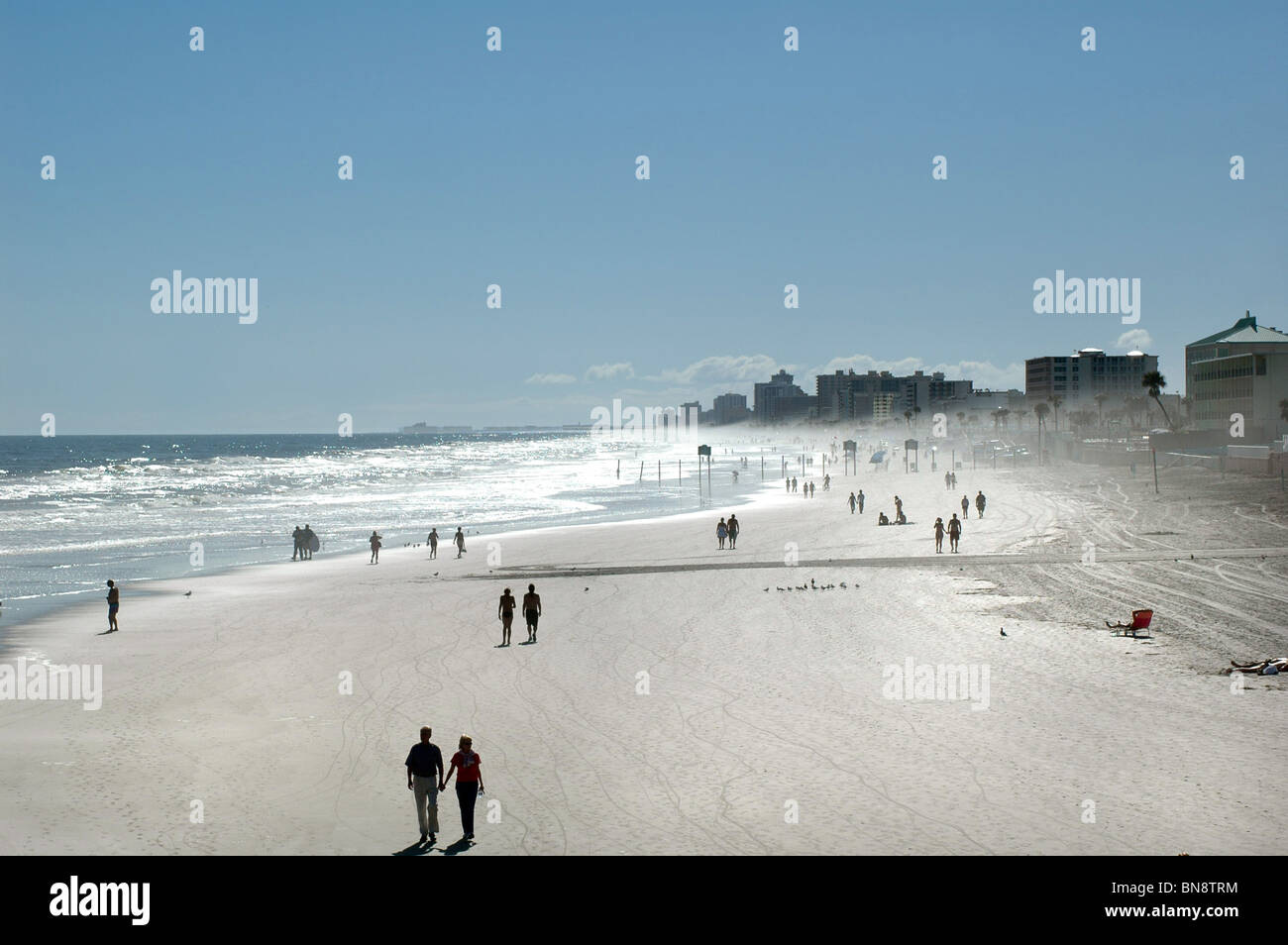 People walking on beach Stock Photo - Alamy