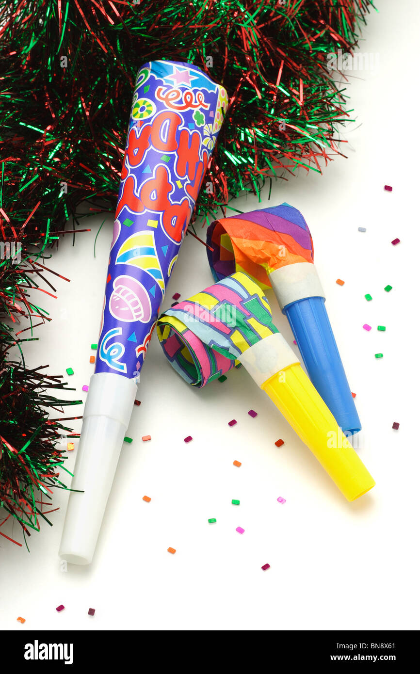 Colorful Party horn and blowers on white background Stock Photo - Alamy