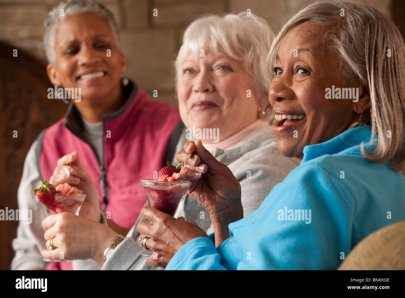 Friends eating dessert in restaurant Stock Photo - Alamy