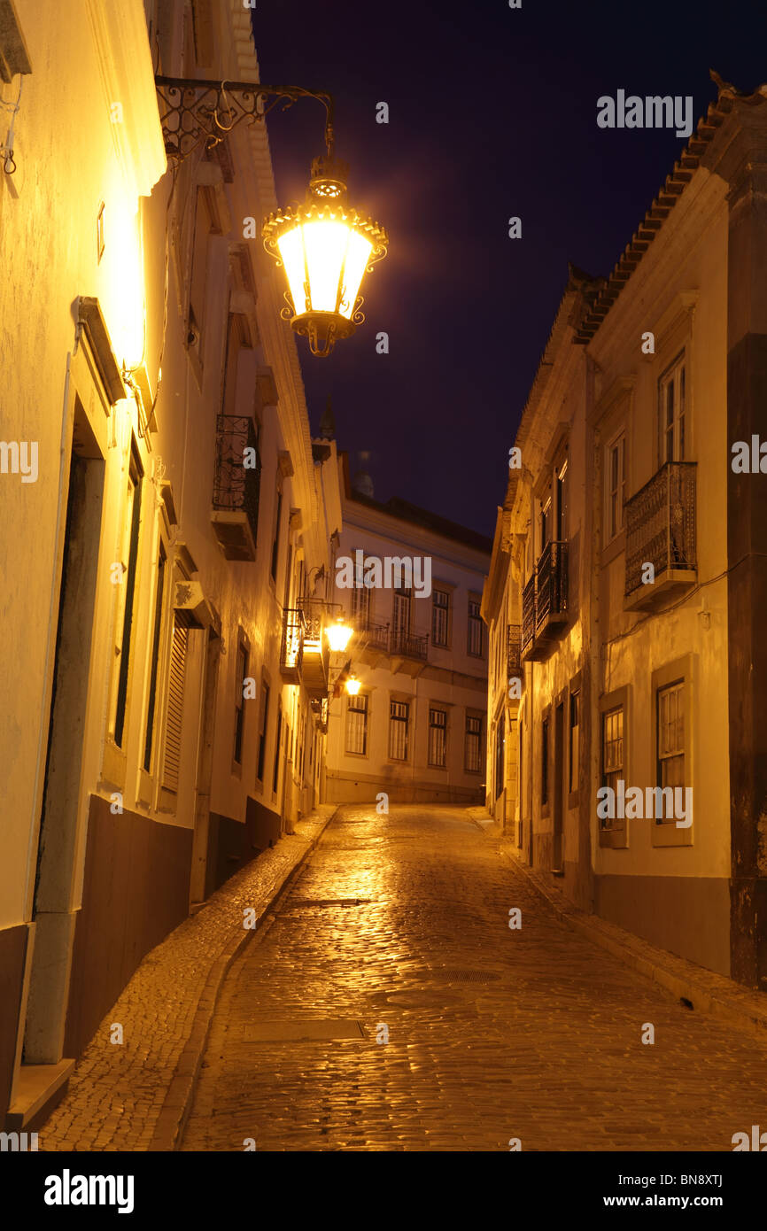 Street at night in the old town of Faro, Portugal Stock Photo - Alamy