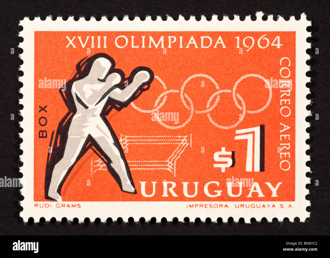 Postage stamp from Uruguay depicting a boxer, boxing ring and Olympic ...