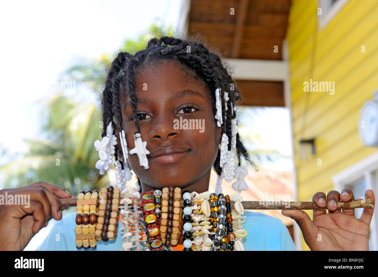 Native Honduran girl sells bracelets near Caribbean Cruise ship in Isla ...