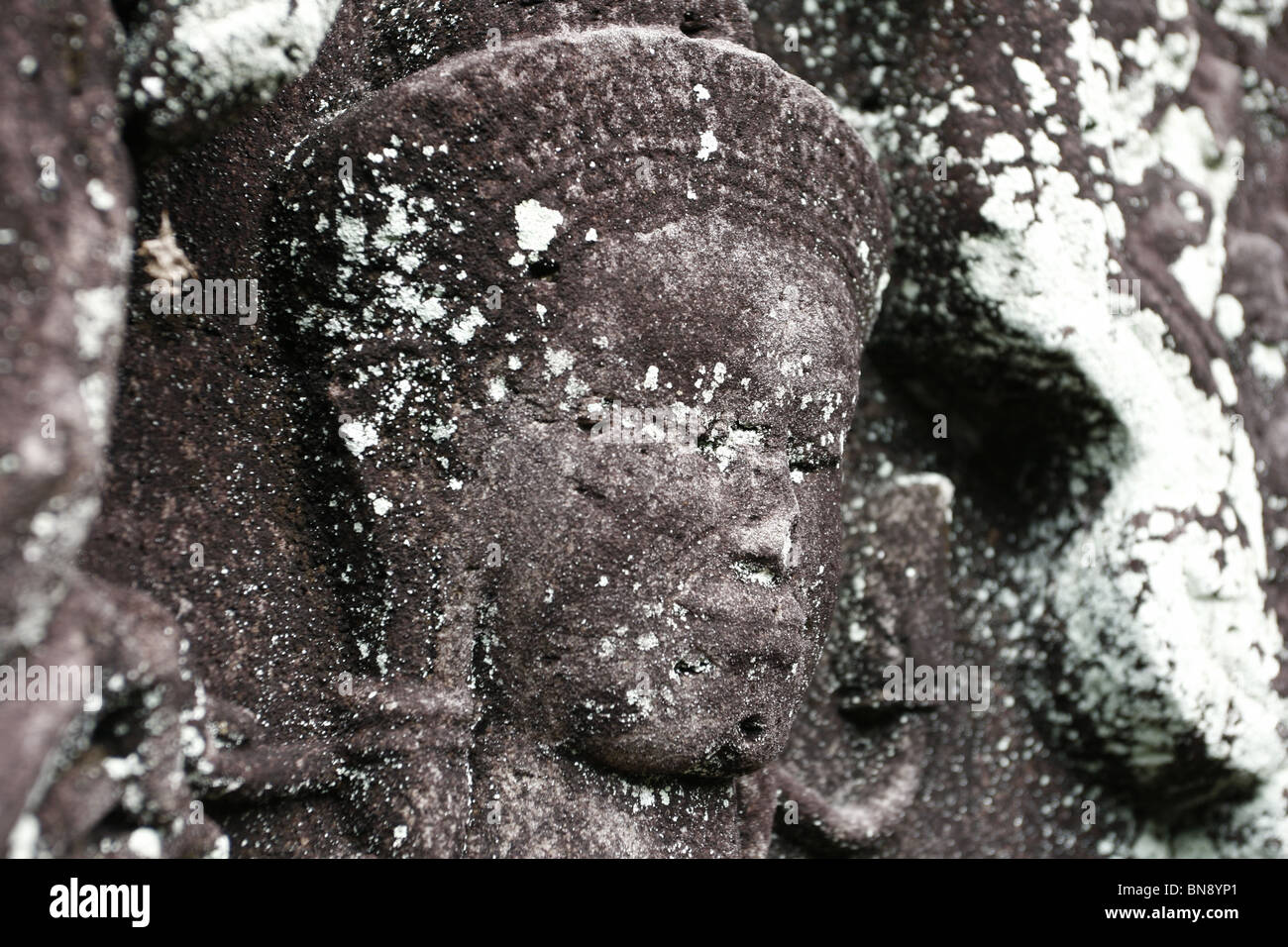 The sculpture of a devata, a female deity, in a temple wall at Preah ...