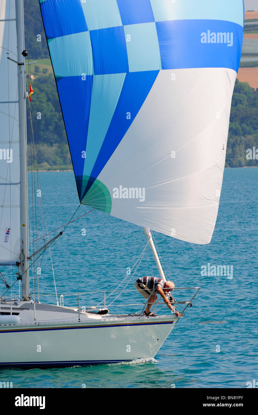 A sailor fixing the spinnaker on his boat Stock Photo - Alamy