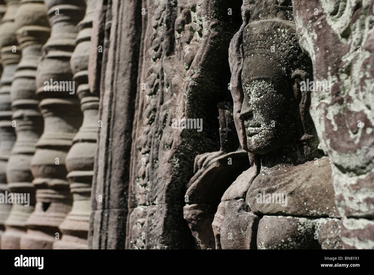 The sculpture of a devata, a female deity, in a temple wall at Preah ...