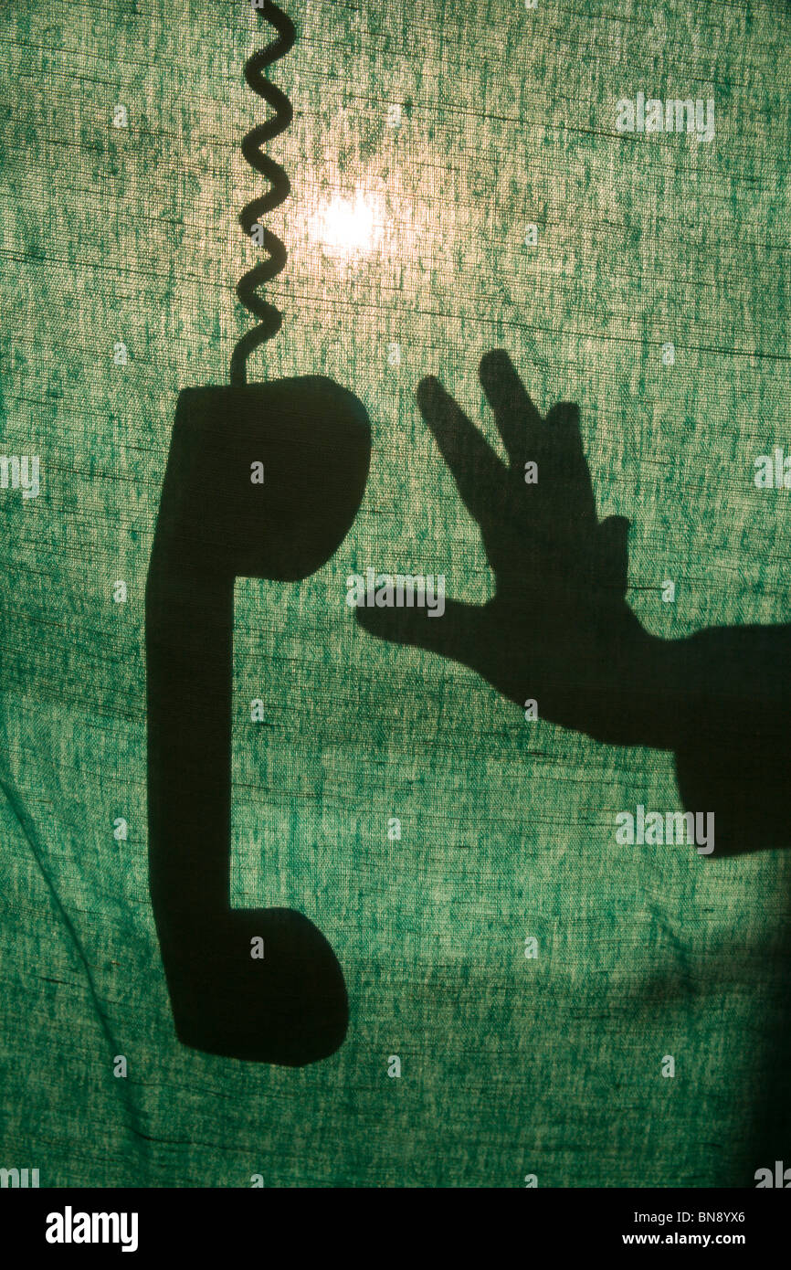shadow of phone and hand shadow of phone and hand Stock Photo - Alamy