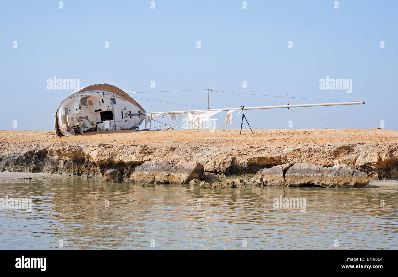 Wreckage of a sailing yacht washed up on a beach Stock Photo - Alamy