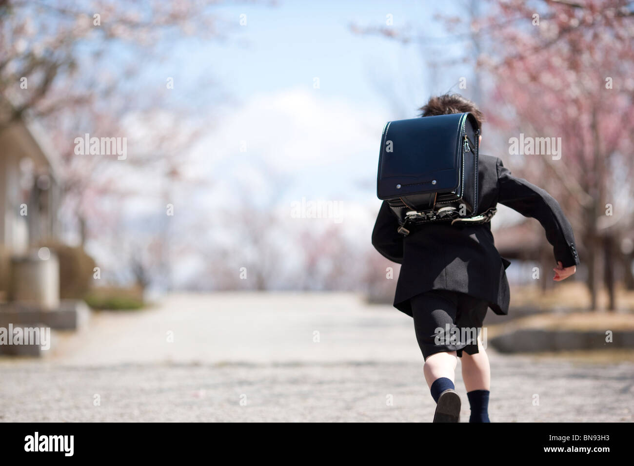 Elementary school boy running Stock Photo - Alamy