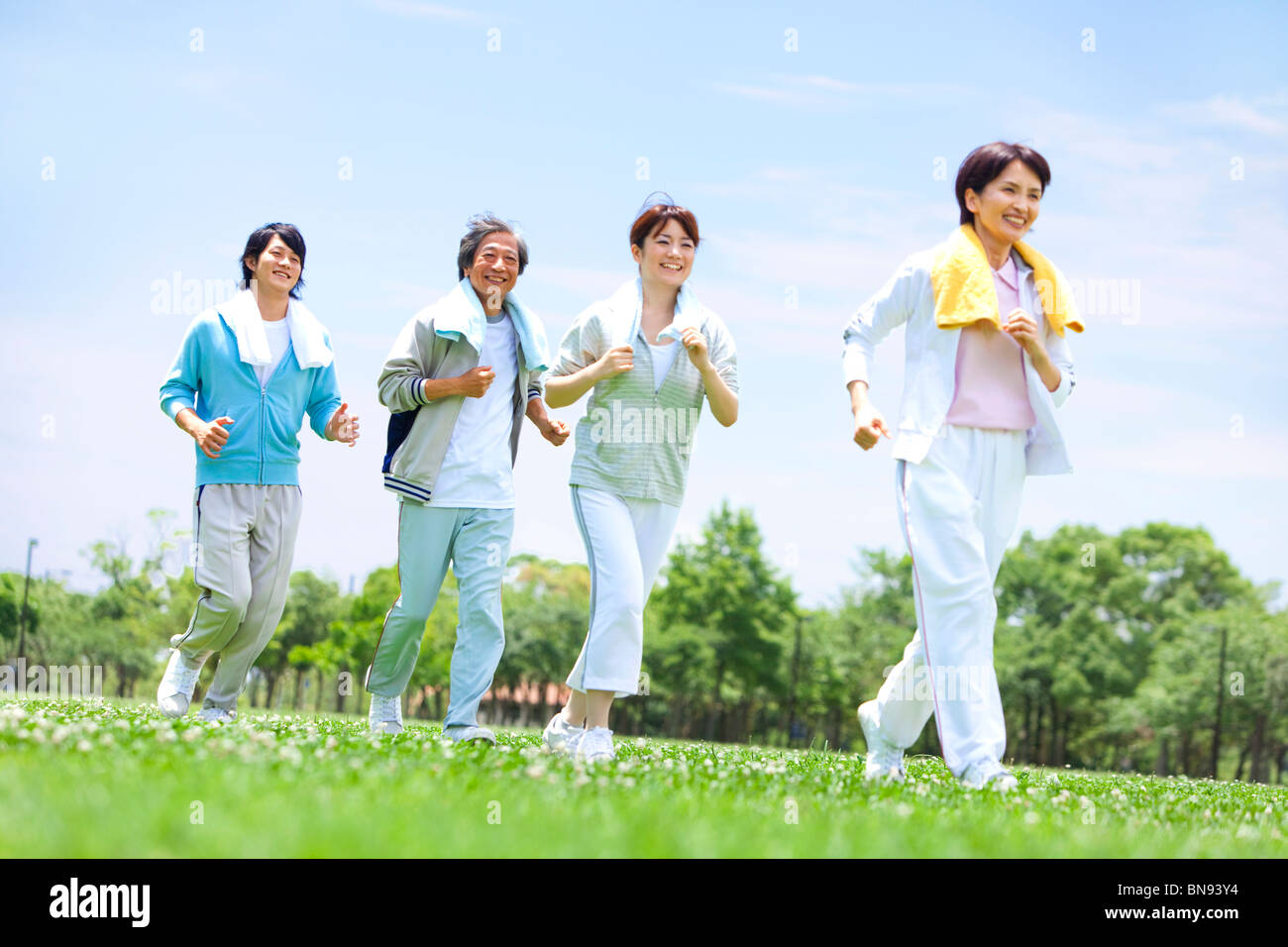 Two generations of family jogging Stock Photo - Alamy