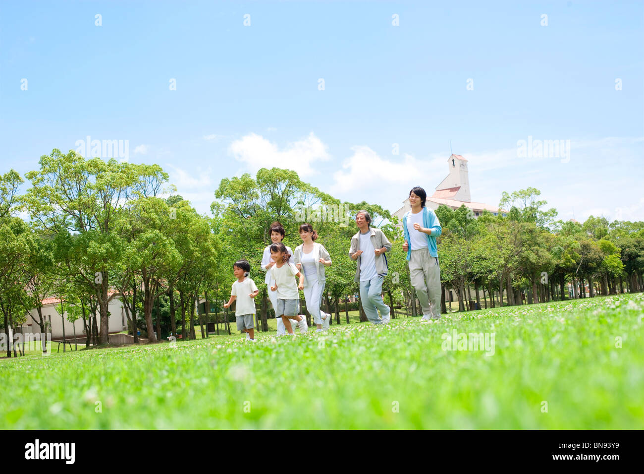 Three generation of family jogging Stock Photo - Alamy