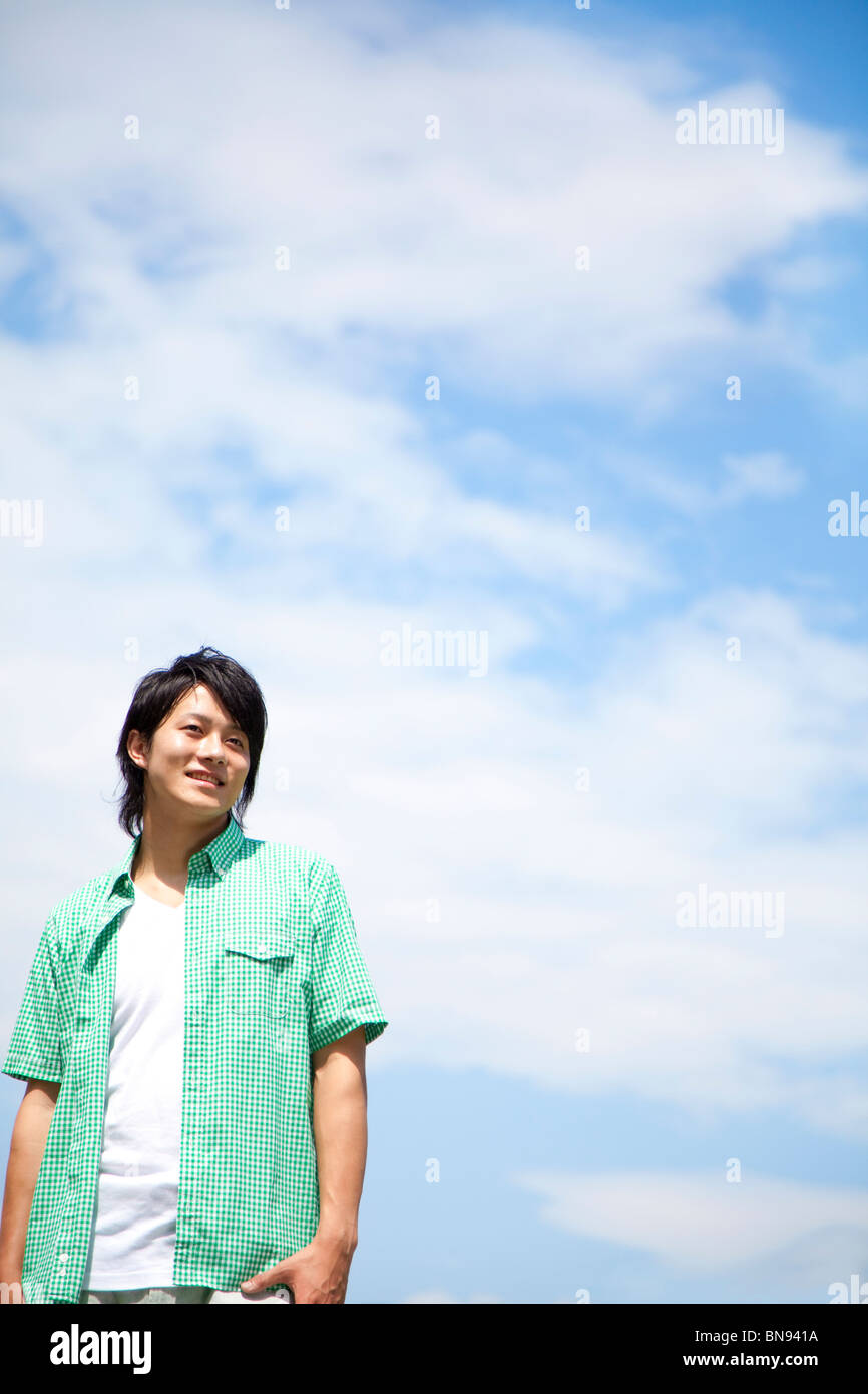 Man standing and smiling Stock Photo - Alamy